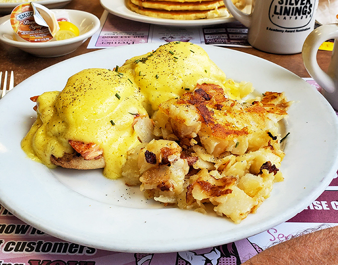 Eggs Benedict draped in hollandaise that would make a French chef nod in approval. Golden potatoes on the side ensure no one leaves hungry.