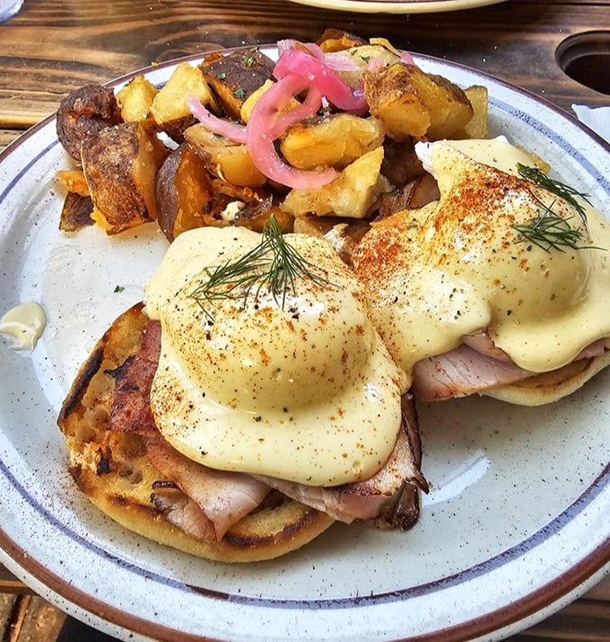 Benedict Arnold may have been a traitor, but these eggs Benedict with pickled onions and crispy potatoes have pledged unwavering allegiance to your taste buds.