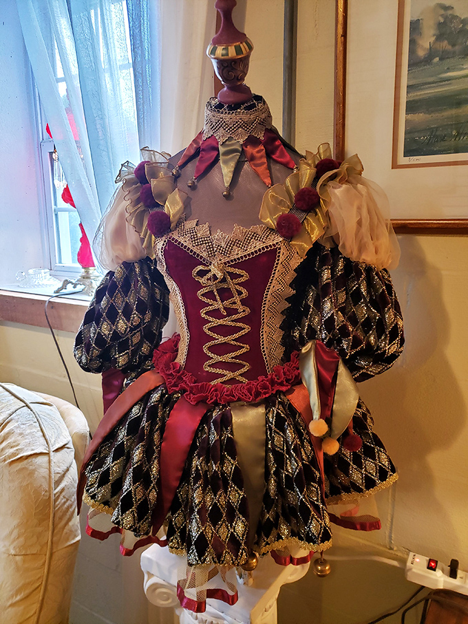 Not your average department store mannequin! This elaborate jester costume whispers tales of Renaissance fairs, theatrical productions, and someone's extraordinary dedication to craftsmanship.