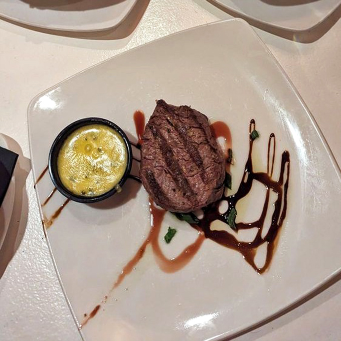 Perfection needs no embellishment. This filet, accompanied by its golden companion of butter, proves that simplicity executed flawlessly is the ultimate luxury.