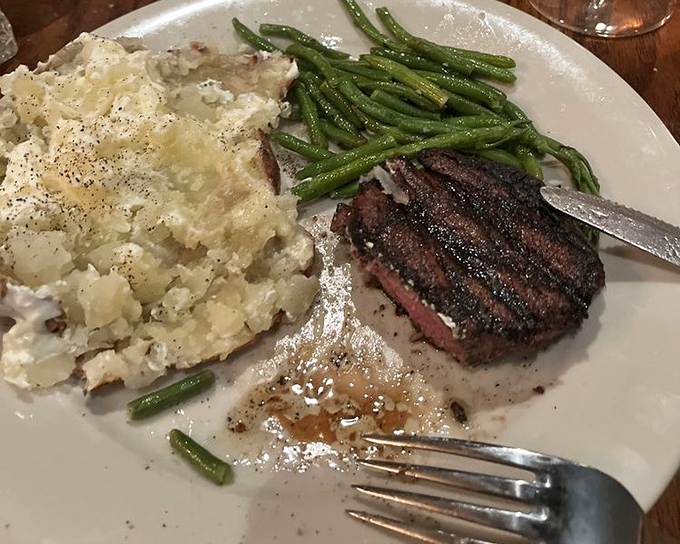 This filet mignon doesn't need fancy garnishes to impress&mdash;just a perfect sear, seasoned crust, and that loaded baked potato sidekick stealing part of the show. 