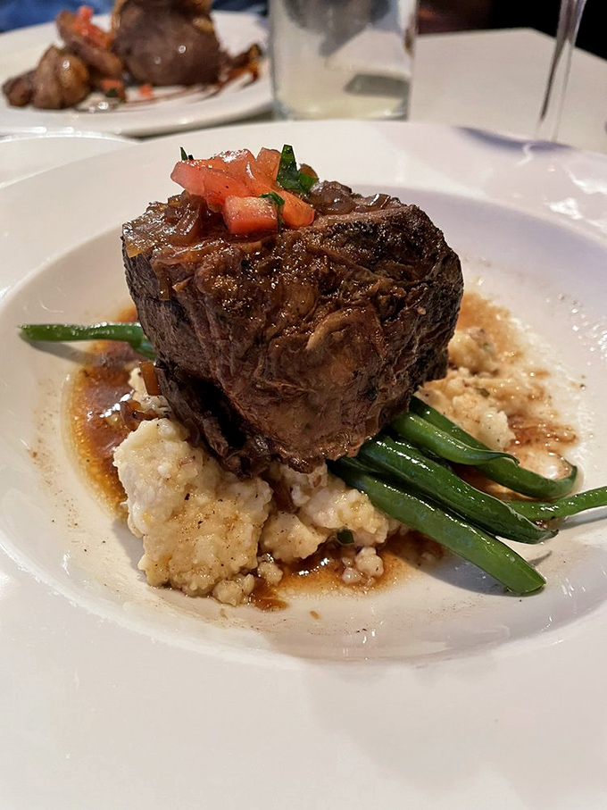 This isn't just steak&mdash;it's a monument to carnivorous pleasure, perfectly seared and resting on a cloud of mashed potatoes like a meaty throne.