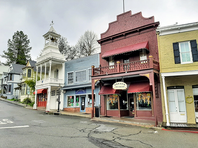 Pastel perfection lines the street, where Victorian architecture and small-town charm create a postcard-worthy scene at every turn.