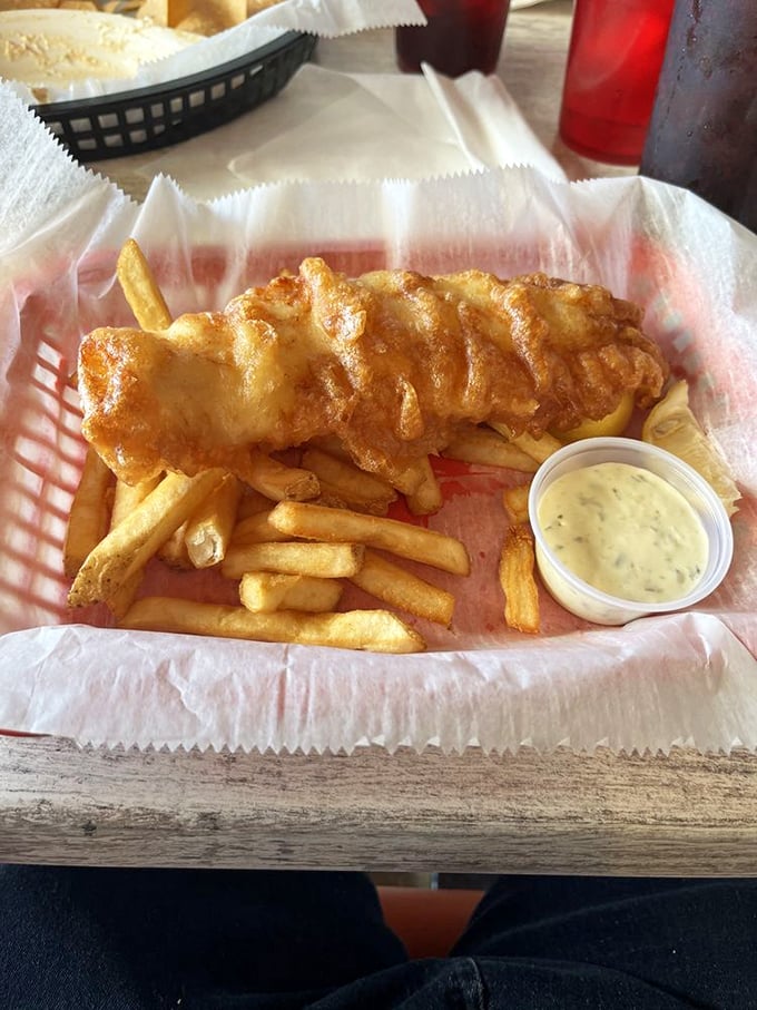 Fish and chips that would make a British pub-goer homesick. The golden batter crackles with each bite, while the tartar sauce stands ready for duty.