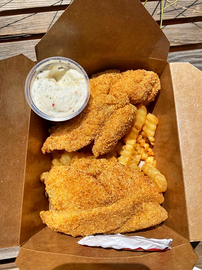 Golden-crusted fish and chips that would make a British pub jealous, served in an unpretentious cardboard container &ndash; because fancy plates would just get in the way.
