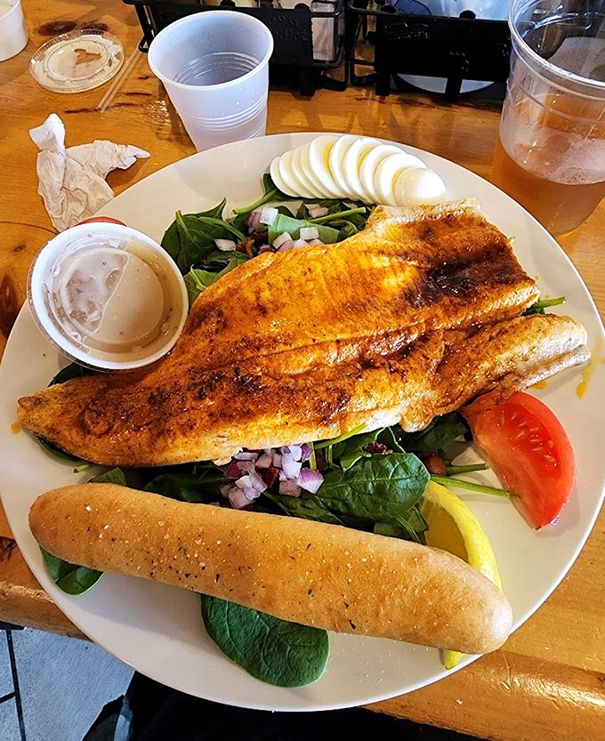 Golden fish fry perfection that proves sometimes the simplest preparations create the most extraordinary flavors and memories.