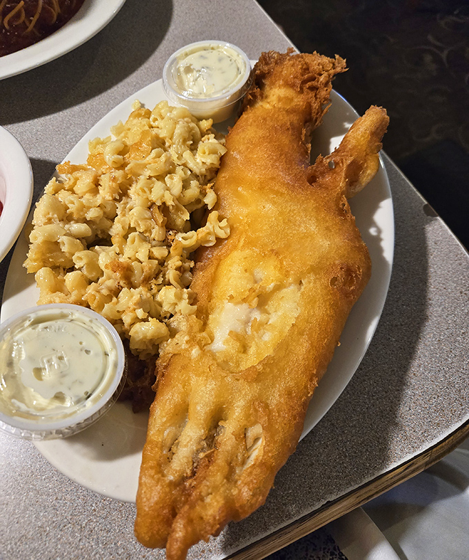 This isn't just fish&mdash;it's golden-armored treasure from the deep, accompanied by mac and cheese that clearly didn't come from a box.