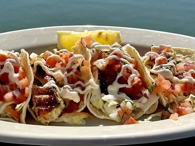 These fish tacos aren't just a meal, they're a coastal vacation on a plate. Fresh fish, bright salsa, and that drizzle of sauce that ties it all together.