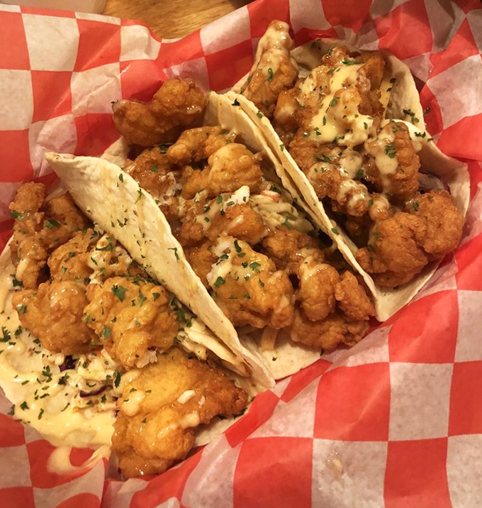 These aren't your average fish tacos; they're golden parcels of coastal perfection.