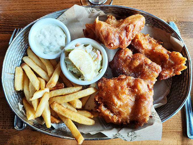 Fish and chips that would make a British pub nervous. Golden, crispy batter protecting flaky white fish, with fries that deserve their own fan club.