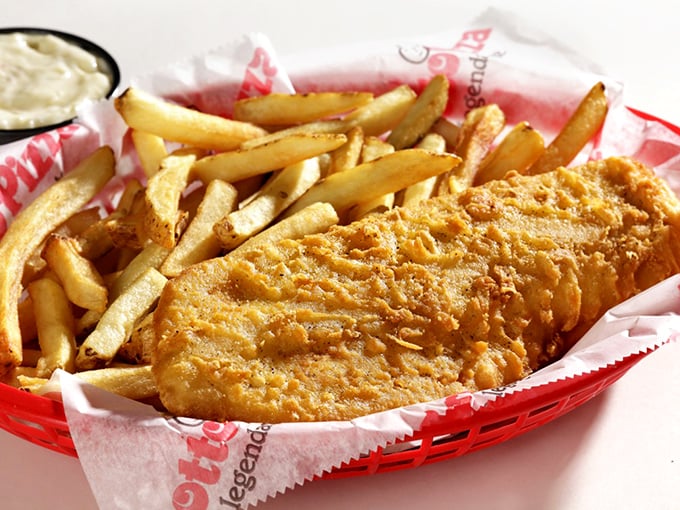 Fish and chips that would make a New Englander do a double-take. The crispy batter shatters just right, revealing flaky white fish beneath.