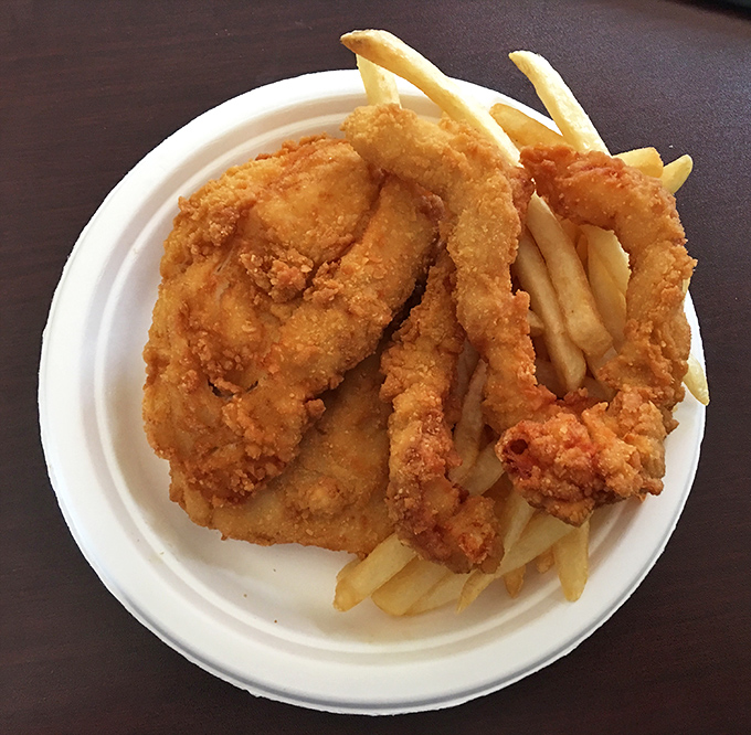 Golden-battered fish and chips that shatter with each bite, revealing flaky white cod beneath. The desert's most convincing argument that oceans are overrated.