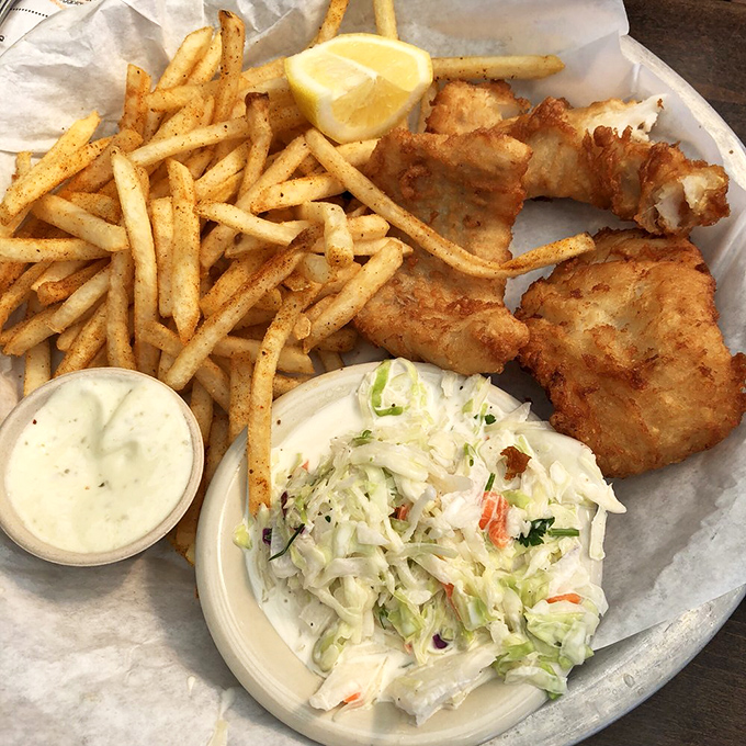 Golden fish and chips with coleslaw &ndash; the kind of plate that makes you wonder why you ever eat anything else.