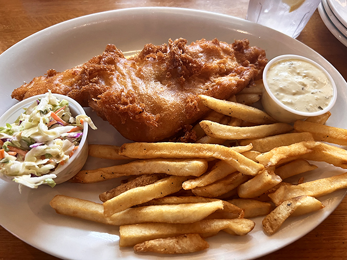 Fish and chips that puts the "crisp" in crispy. Golden-battered perfection flanked by fries and coleslaw&mdash;the holy trinity of comfort food.