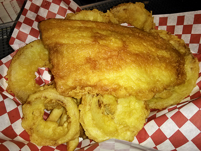 The crunch heard 'round the world! This golden fish fillet nestled among crispy onion rings is comfort food elevated to an art form.
