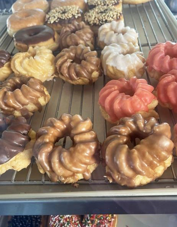 French crullers lined up like edible art&mdash;their ridged exteriors glistening with glaze, waiting to dissolve on your tongue.