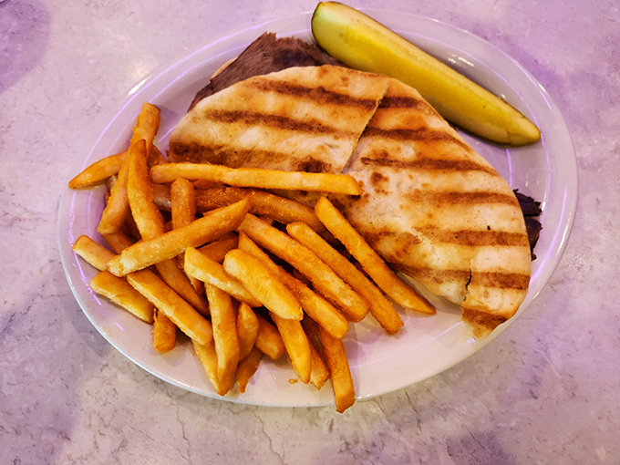 A sandwich that demands to be photographed before eaten. Those perfectly grilled marks on the bread are like the autograph of a skilled short-order cook.