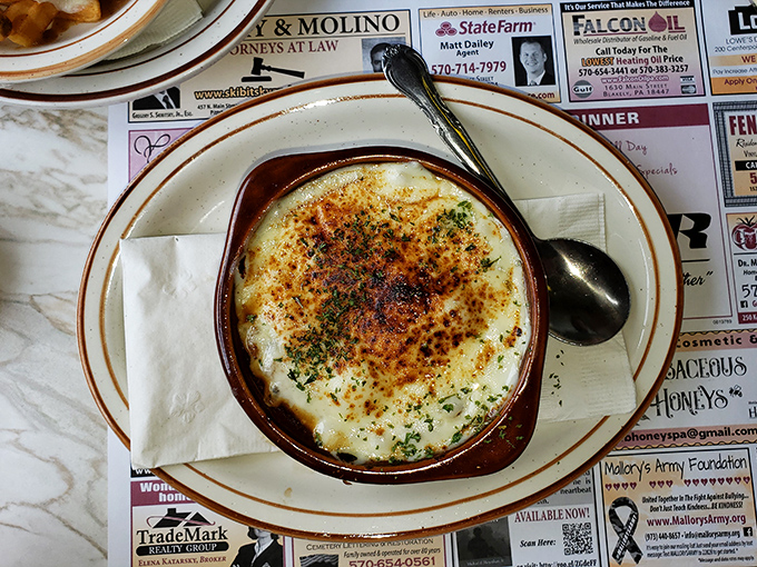 French onion soup so rich and bubbly, it could make a Parisian chef weep tears of joy.
