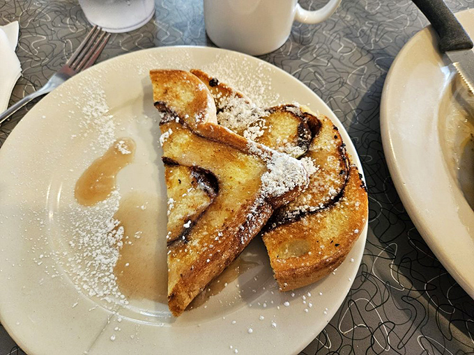 French toast so beautifully golden, it practically glows like a breakfast beacon calling your name from across the diner.