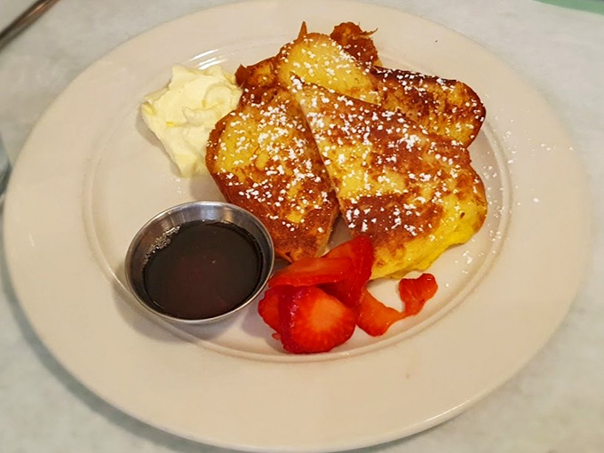 French toast that makes regular toast feel like it needs to step up its game. Golden, crisp exterior giving way to custardy perfection within.