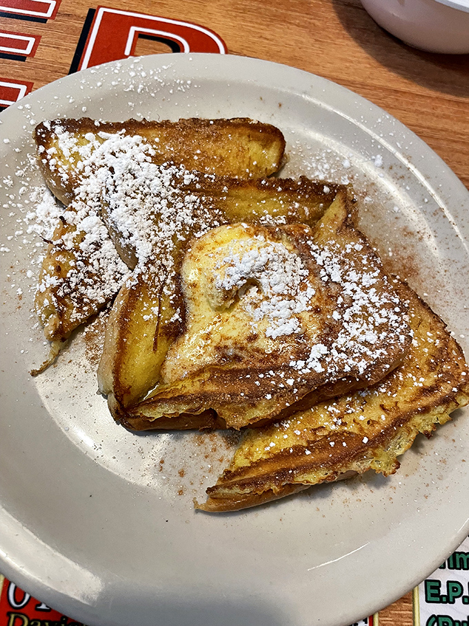 French toast so perfectly golden it practically glows – this is what breakfast dreams are made of, folks.