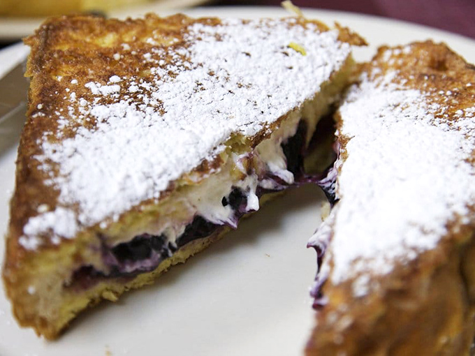 This isn't just French toast&mdash;it's a berry-stuffed masterpiece dusted with powdered sugar. Breakfast or dessert? The correct answer is "Yes."