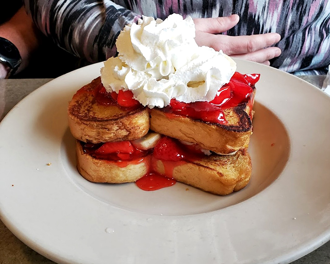 French toast that's dressed for success with strawberries and enough whipped cream to make your cardiologist wince. Worth every delicious calorie.