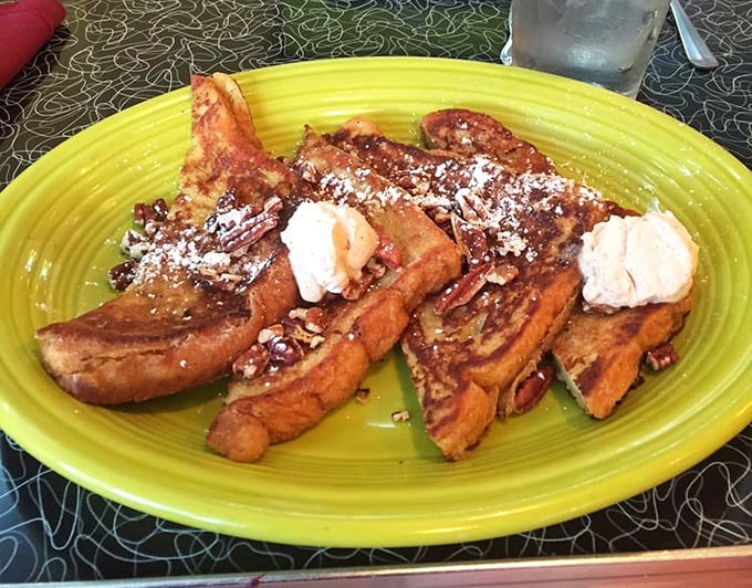 French toast that looks like it's auditioning for a breakfast beauty pageant. That powdered sugar dusting? Chef's kiss.