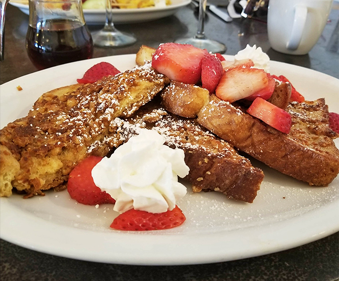 French toast that's clearly been to finishing school. Those fresh strawberries aren't just garnish&mdash;they're jewelry for your breakfast.