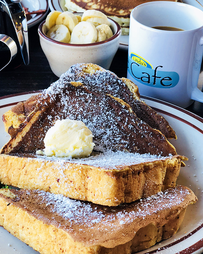 French toast that makes you question every other French toast you've ever had. That fruit cup isn't just an afterthought.