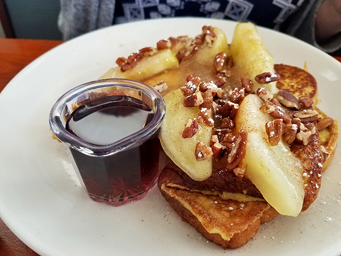 French toast elevated to art form with bananas, pecans, and a drizzle of syrup. Breakfast or dessert? The line deliciously blurs.