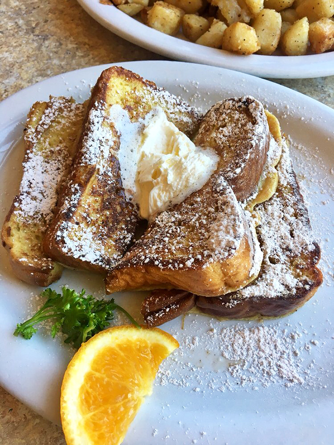 French toast that should have its own agent. Golden, powdered, and stuffed with enough deliciousness to make you contemplate moving to Long Beach permanently.