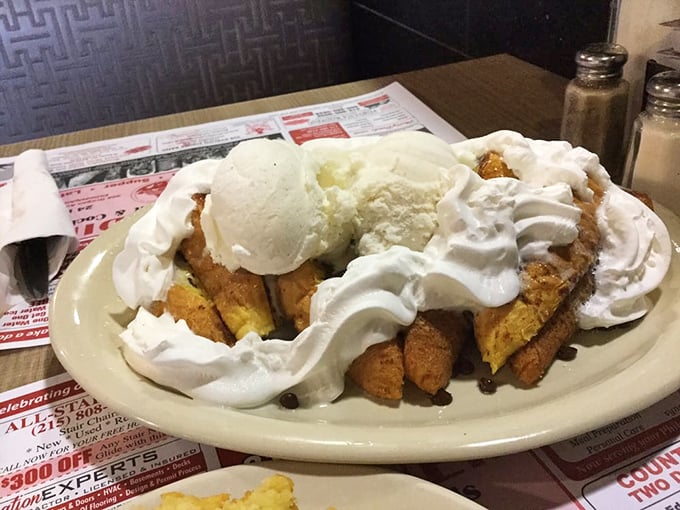 French toast that could make breakfast skeptics set multiple alarms. That mountain of whipped cream isn't just decoration&mdash;it's a lifestyle choice.