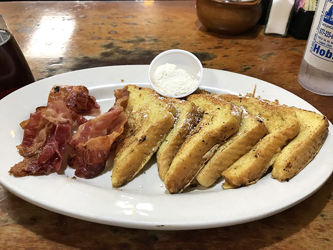 French toast that's achieved golden perfection alongside bacon that's hit that magical sweet spot between crispy and chewy. Breakfast nirvana exists.