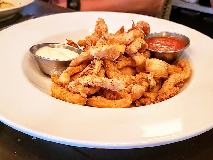 Crispy calamari that shatters with each bite, paired with dipping sauces that make you wonder why you'd ever order anything else.