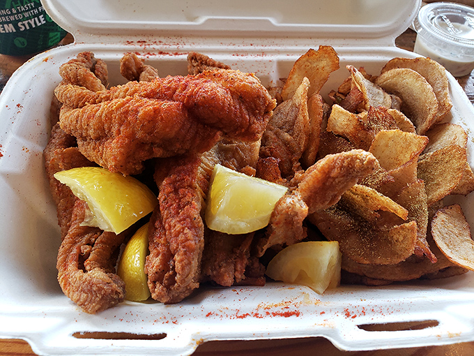 Crispy catfish perfection that proves Southern comfort food reaches heavenly heights when done right.