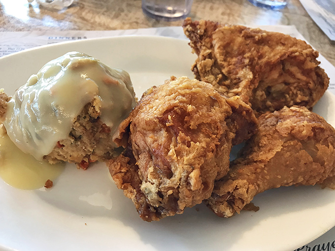 Crispy meets juicy in this broasted chicken masterpiece, where one piece comes bathed in gravy like it's enjoying its own spa treatment.