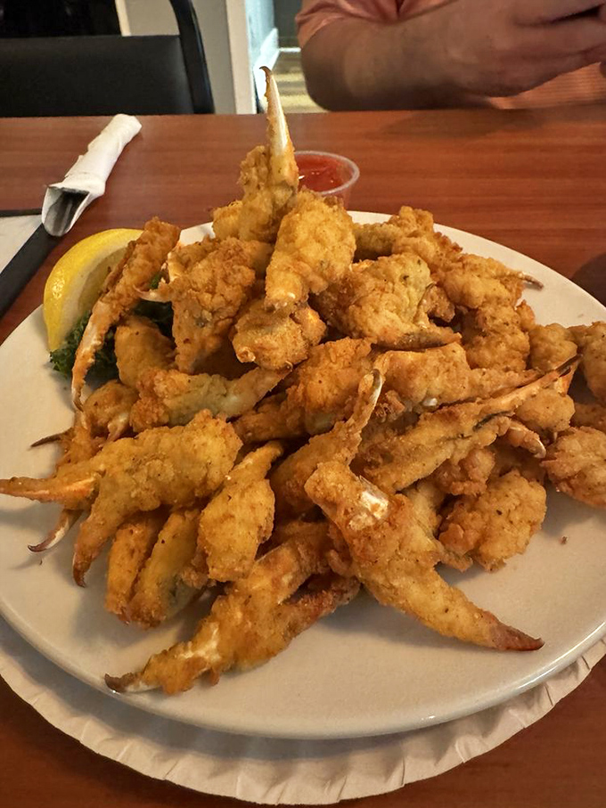 These fried crab claws aren't just appetizers; they're little crispy miracles of the sea that disappear faster than Florida sunshine after a summer storm.