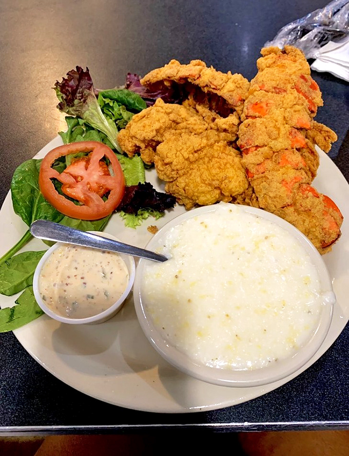 Golden-fried perfection meets creamy grits &ndash; a Southern duet that sings in perfect harmony on your taste buds.