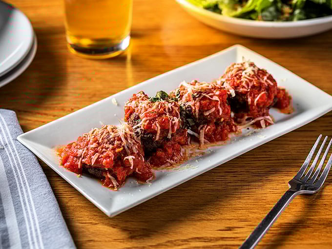 These aren't your average meatballs. They're little spheres of happiness, bathed in marinara and showered with cheese like confetti at a flavor parade.