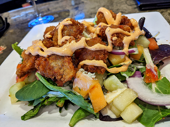 Golden fried oysters that crunch like autumn leaves but taste like pure oceanic bliss on every bite.