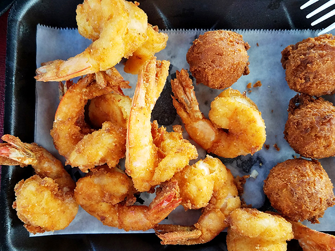 Golden-battered shrimp and hush puppies that would make Neptune himself swim to shore. Crispy perfection that snaps between your teeth.