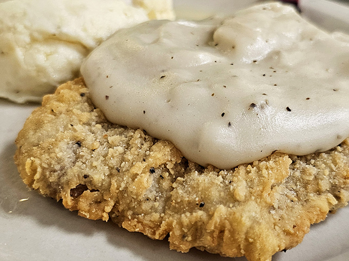 Country-fried steak smothered in peppery gravy alongside green beans and mashed potatoes &ndash; the holy trinity of Midwest comfort food.
