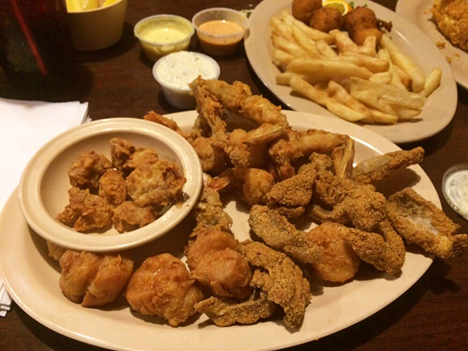 The holy trinity of Florida seafood: perfectly golden catfish, plump shrimp, and crispy sides. Diet plans come here to die happy deaths.