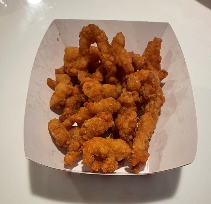 These golden fried clams aren't just seafood; they're little nuggets of oceanic bliss that crunch like nature's perfect potato chip.