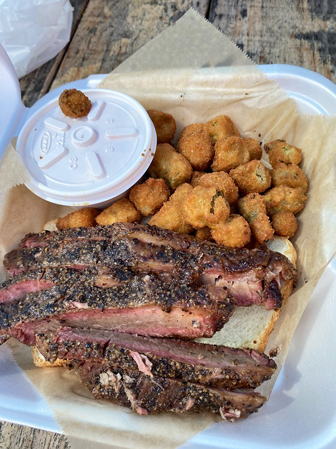 Crispy fried okra and pepper-crusted brisket—a Southern power couple that belongs together like peanut butter and jelly, only with more smoke and sass.