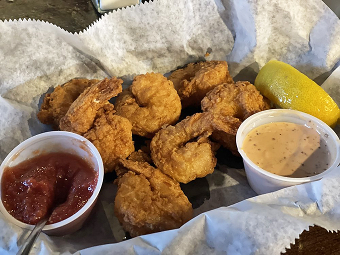 These golden beauties could make a shrimp boat captain jealous with their perfect crispy coating and tender hearts.