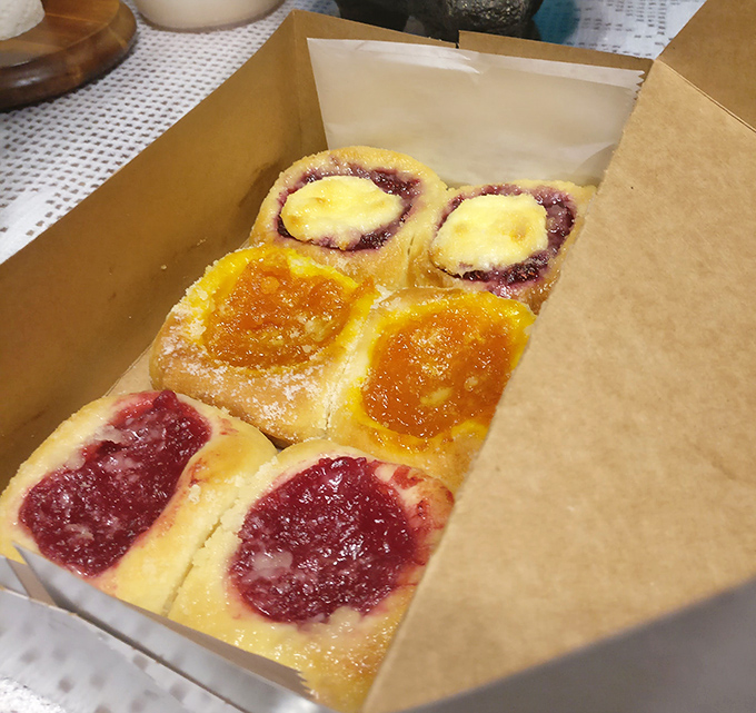A box of fruit kolaches is like Texas sunshine in pastry form &ndash; bright berry and apricot centers nestled in golden dough.