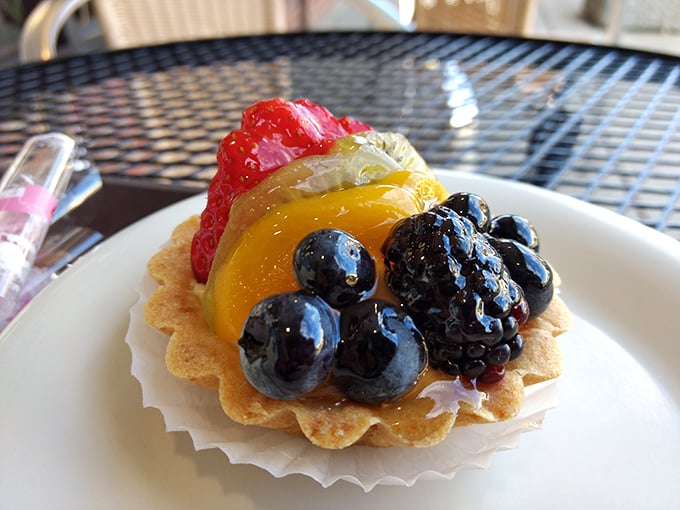This fruit tart isn't just dessert, it's architecture. Perfectly arranged berries glisten like jewels atop a buttery canvas of pastry perfection.