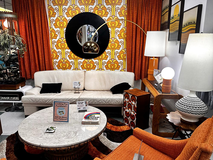 That wallpaper! That sofa! This 1970s living room setup is just waiting for someone to discuss fondue recipes and moon landings.